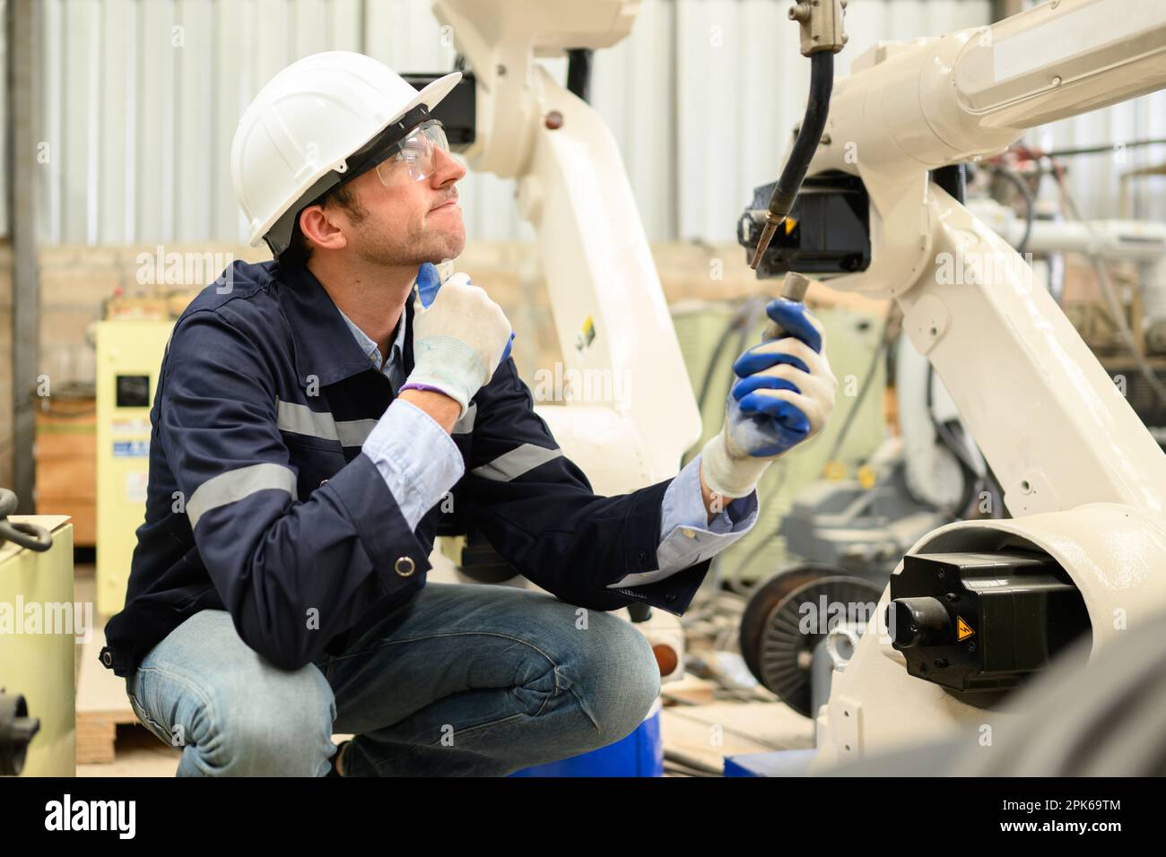 Engineer technician controlling robotic hi-res stock photography and ...