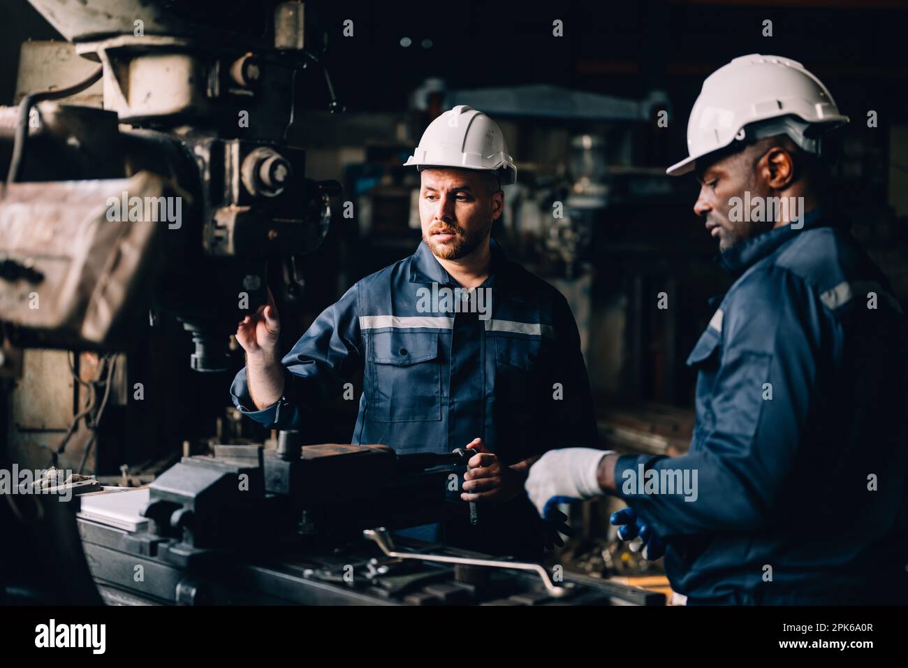 Specialist engineer worker working together at manufacturing plant ...
