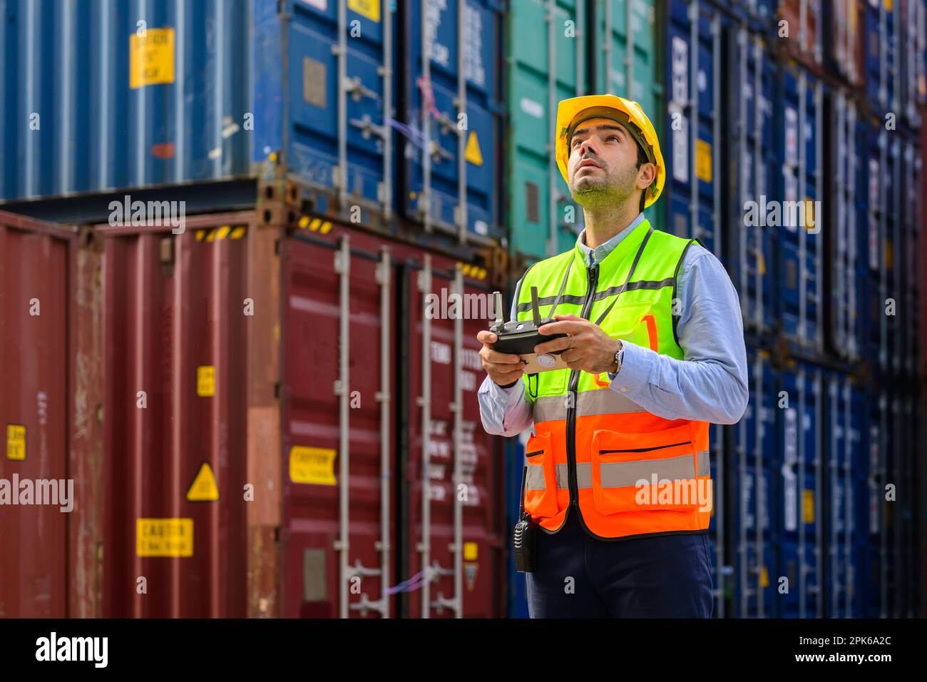 Warehouse engineer worker working at industrial container yard Stock ...