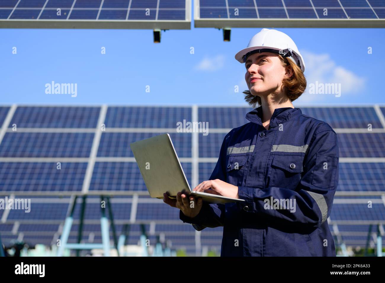 Engineer worker portrait with solar panel at solar farm Stock Photo - Alamy