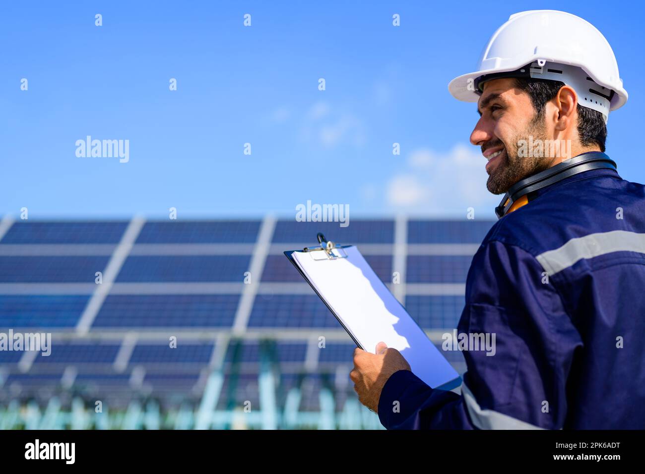 Engineer worker portrait with solar panel at solar farm Stock Photo - Alamy