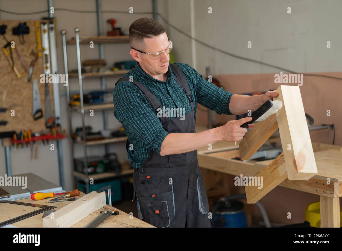 Carpenter cleaning wooden plank from hi-res stock photography and ...