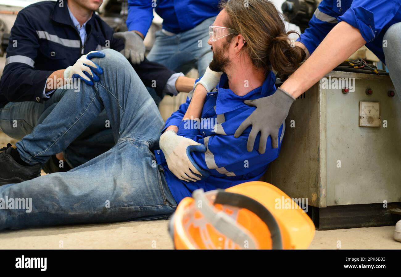 Engineer worker with accident at factory during working Stock Photo - Alamy