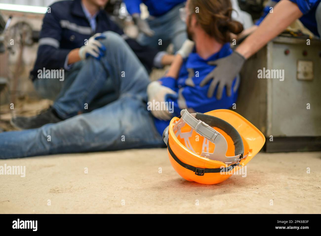 Engineer worker with accident at factory during working Stock Photo - Alamy