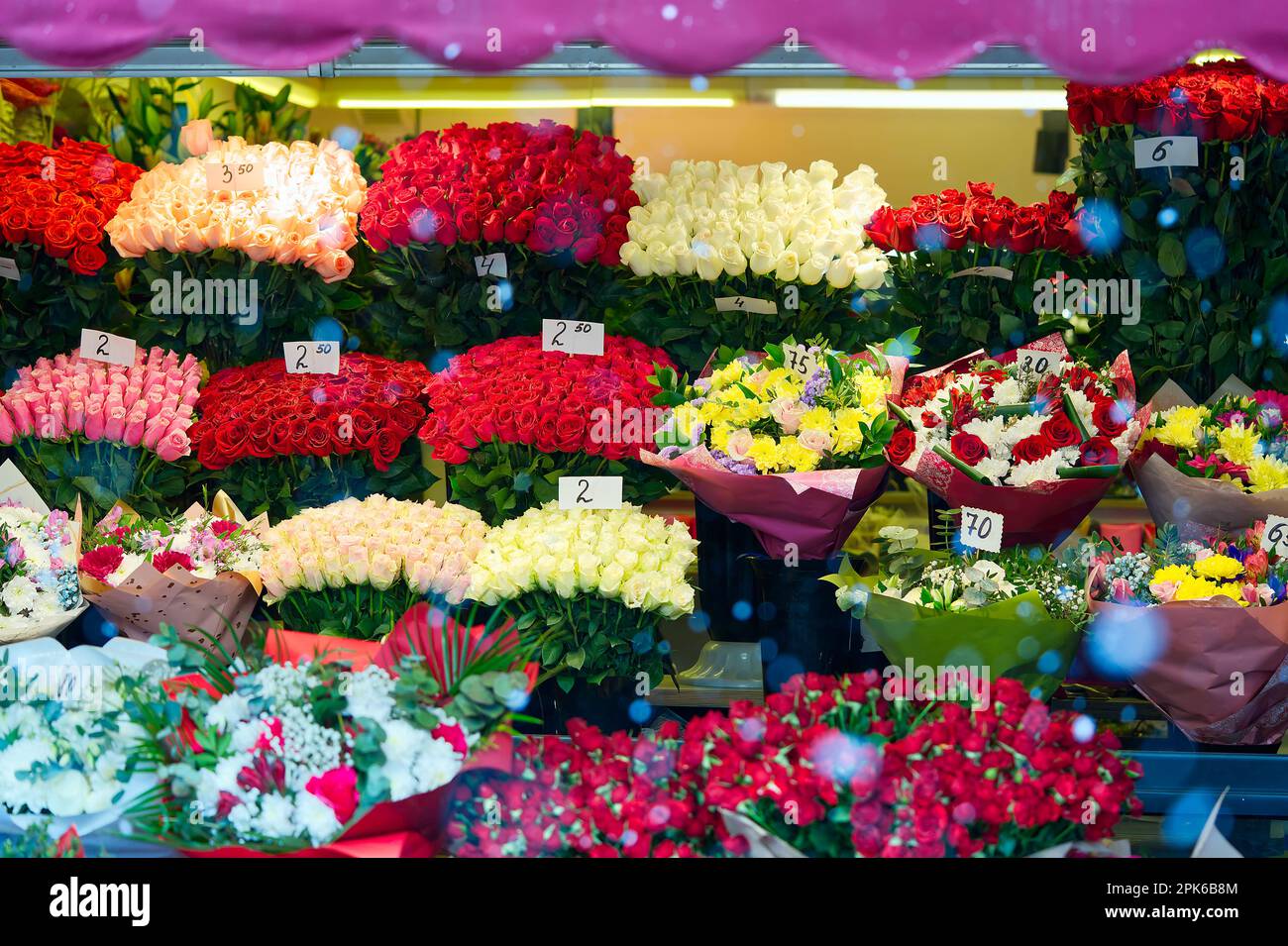 Colorful roses bouquet display in front of flower shop. Flower ...