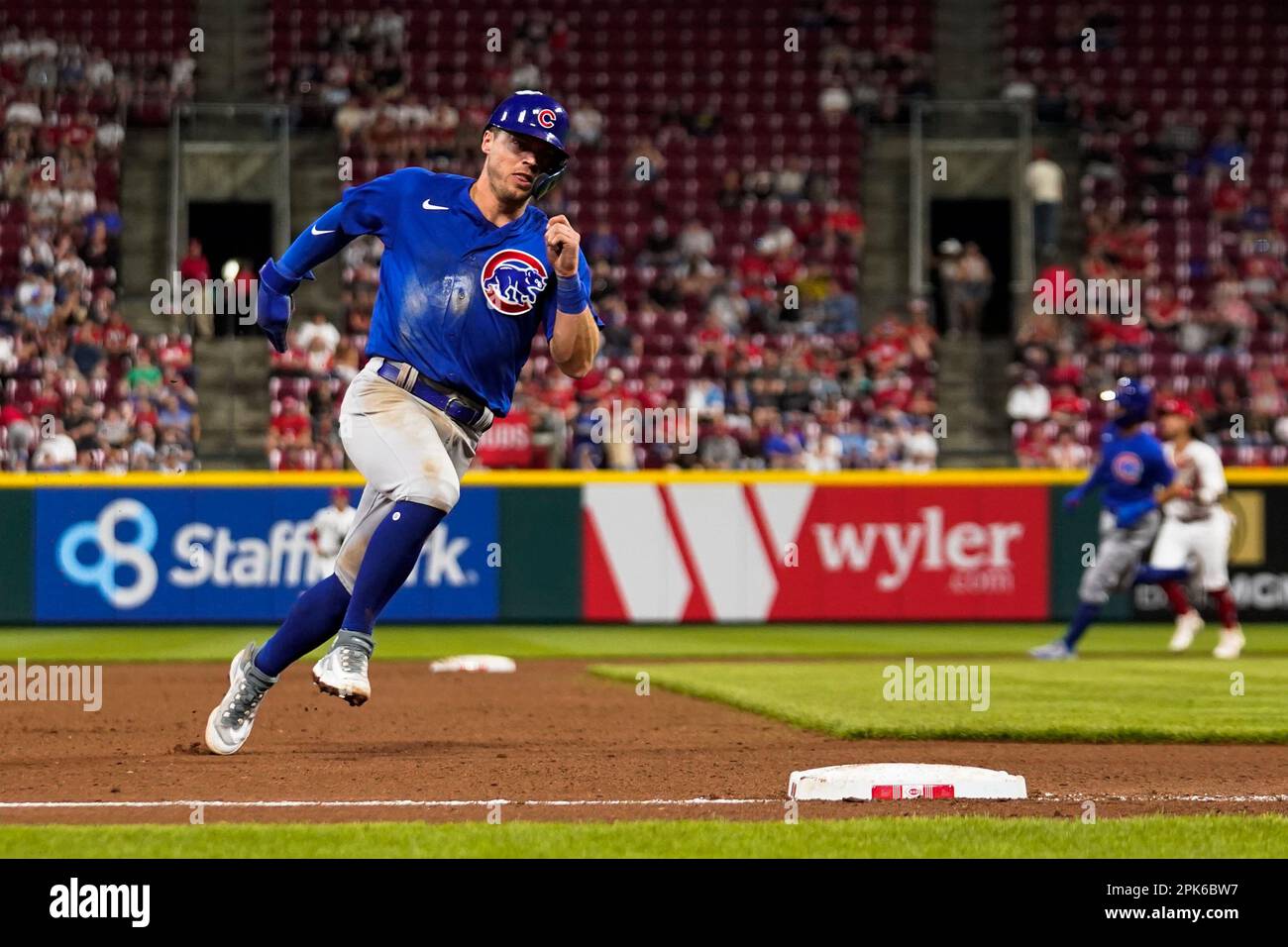 Chicago Cubs' Nico Hoerner rounds third base and scores on an Ian Happ ...