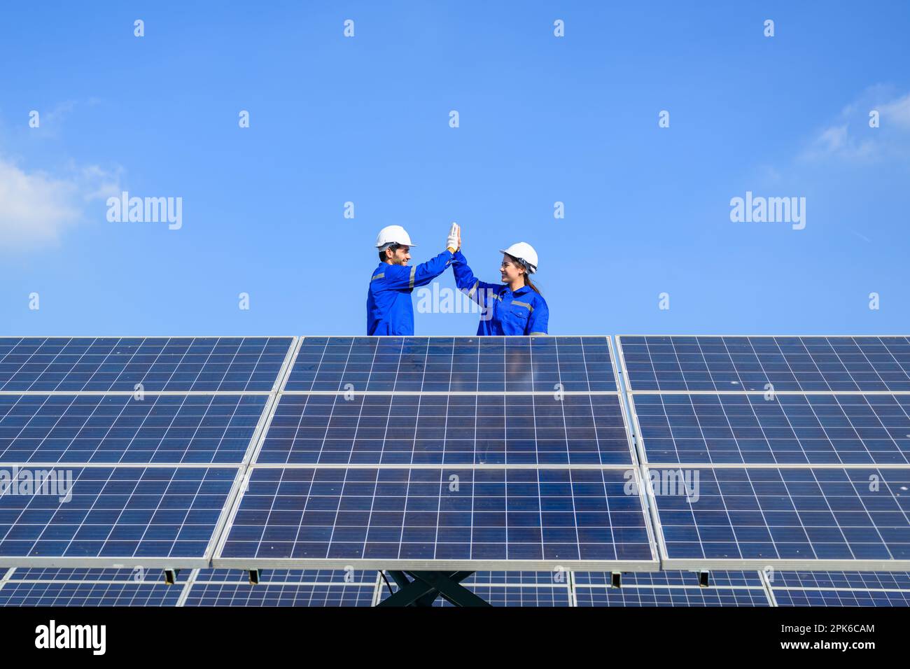 Maintenance worker team working with success at solar panel farm Stock ...