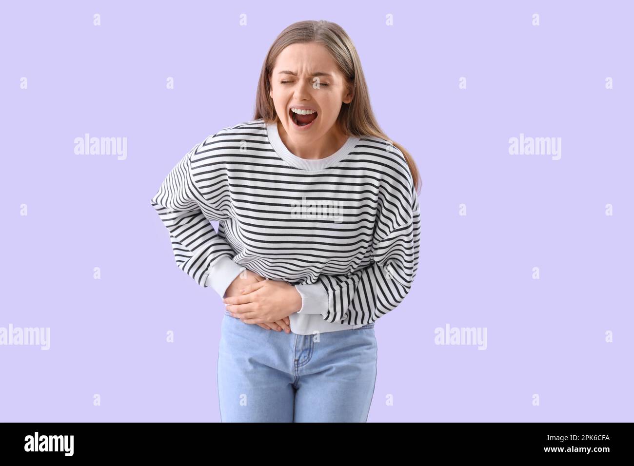 Young woman with appendicitis on lilac background Stock Photo - Alamy
