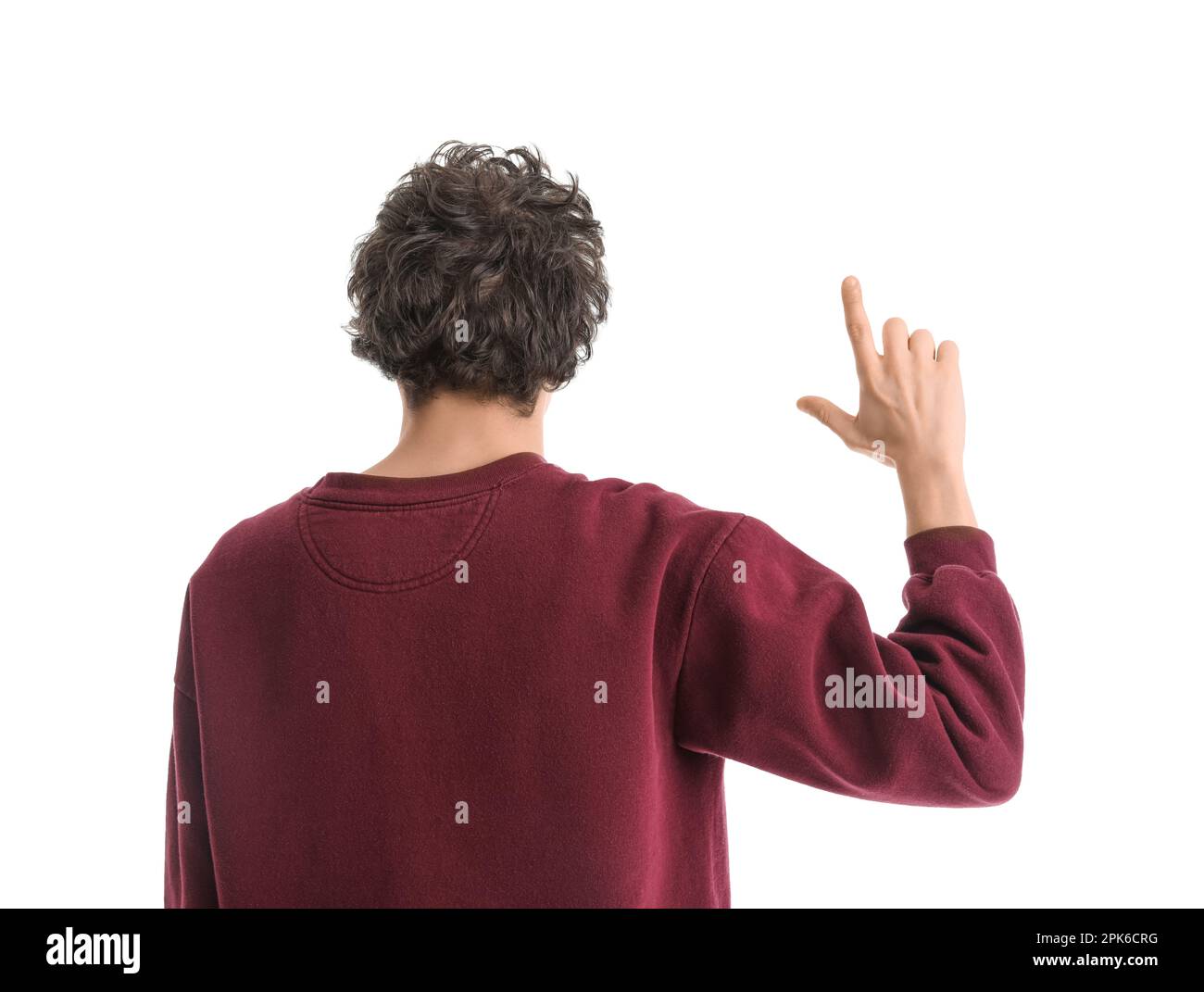 Young man showing loser gesture on white background, back view Stock ...