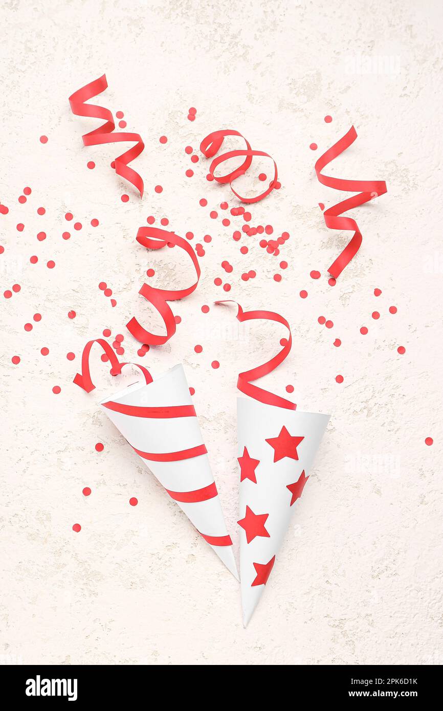 Party cones with serpentine and confetti on grunge background Stock ...