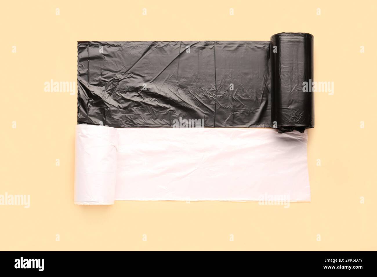 Different rolls of garbage bags on beige background Stock Photo - Alamy