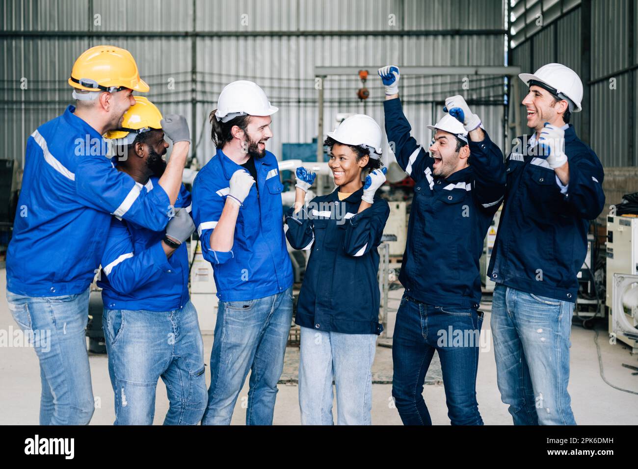Group of successful worker working at factory Stock Photo - Alamy
