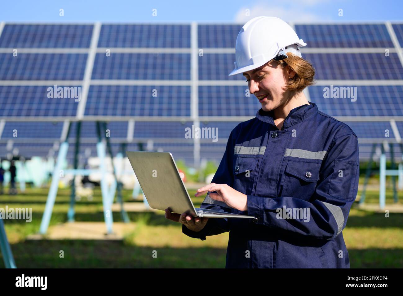 Engineer worker portrait with solar panel at solar farm Stock Photo - Alamy
