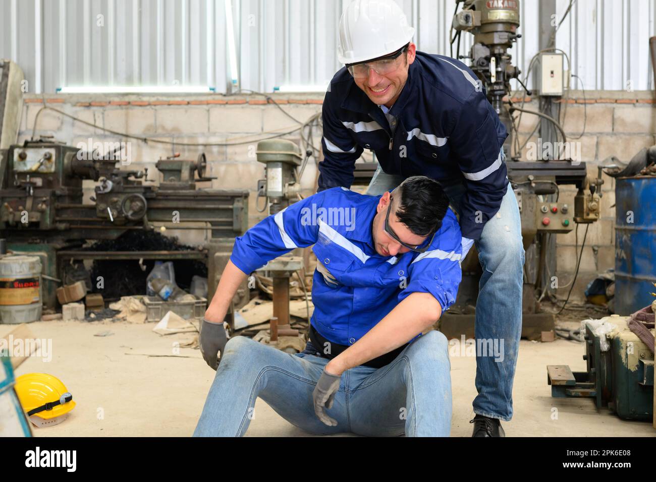 Engineer worker with accident at factory during working Stock Photo - Alamy