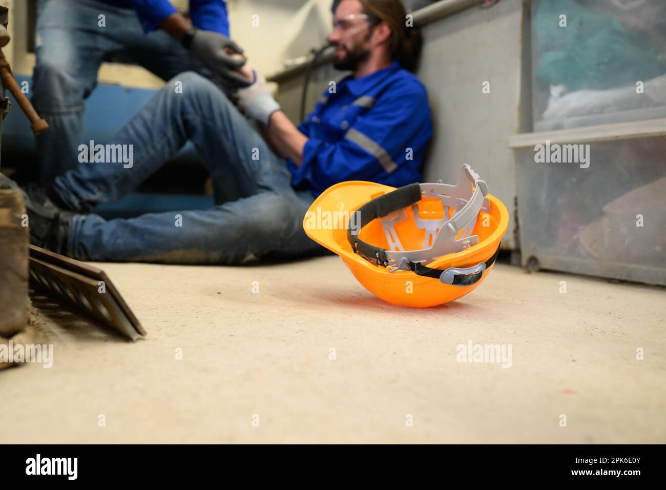Engineer worker with accident at factory during working Stock Photo - Alamy