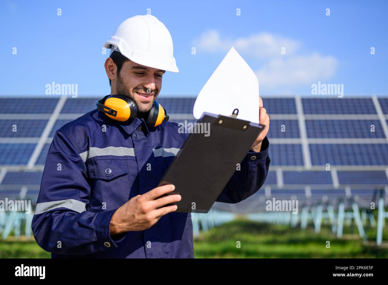 Engineer worker portrait with solar panel at solar farm Stock Photo - Alamy