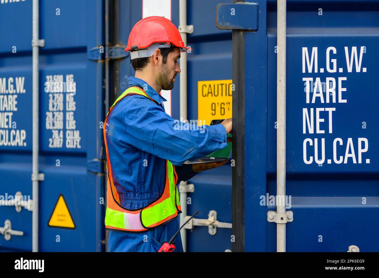 Warehouse engineer worker working at industrial container yard Stock ...