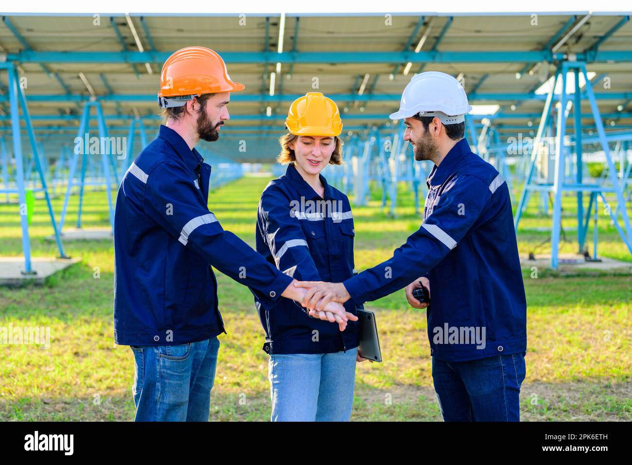 Maintenance worker team working with success at solar panel farm Stock ...