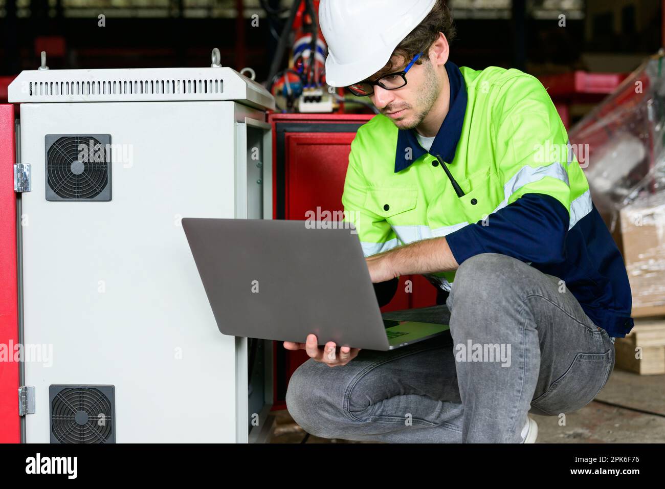 Technician engineer holding robot controller checking and repairing machine Stock Photo - Alamy