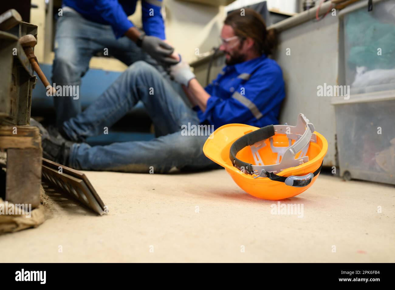 Engineer worker with accident at factory during working Stock Photo - Alamy