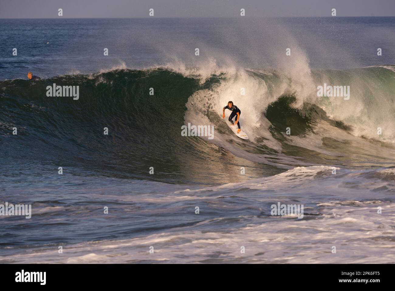Man surfing on large wave, Newport Beach, California, USA Stock Photo ...