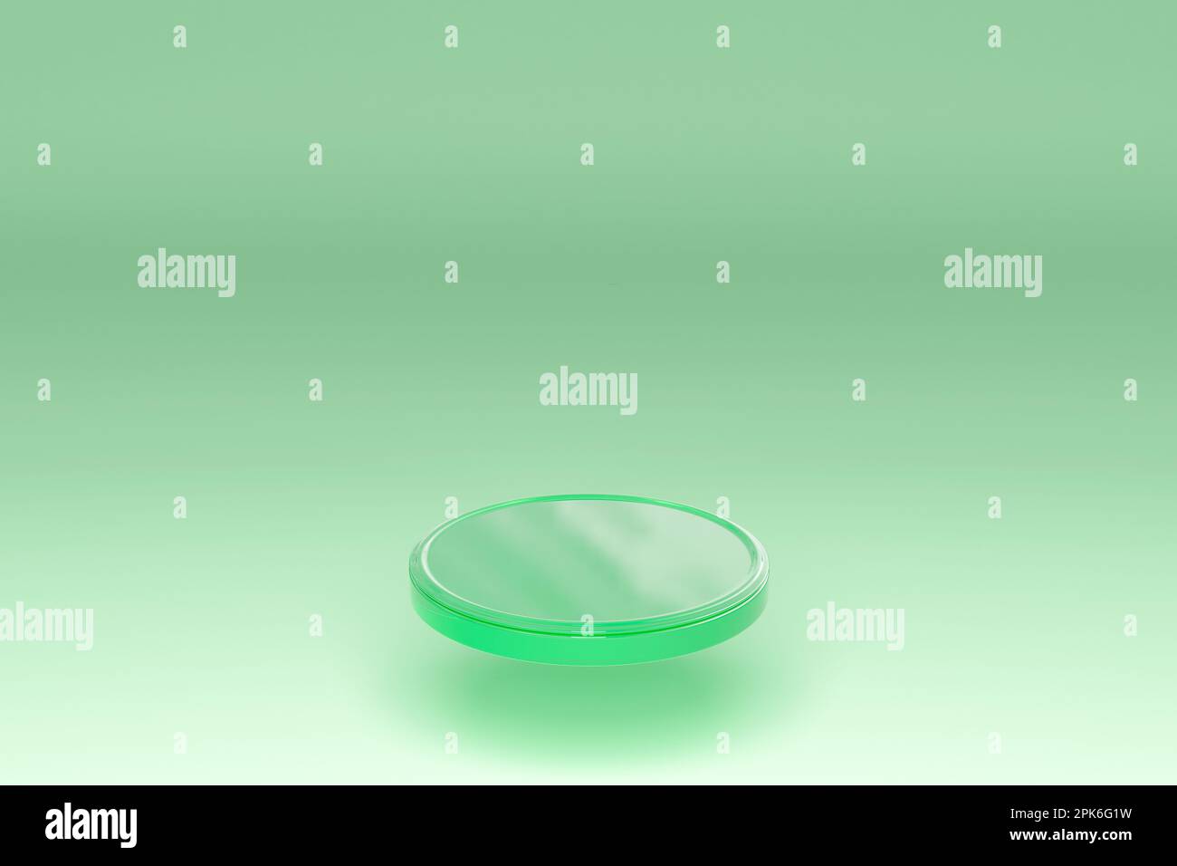 Green glass disk on a light mint background. Minimal scene. A podium ...