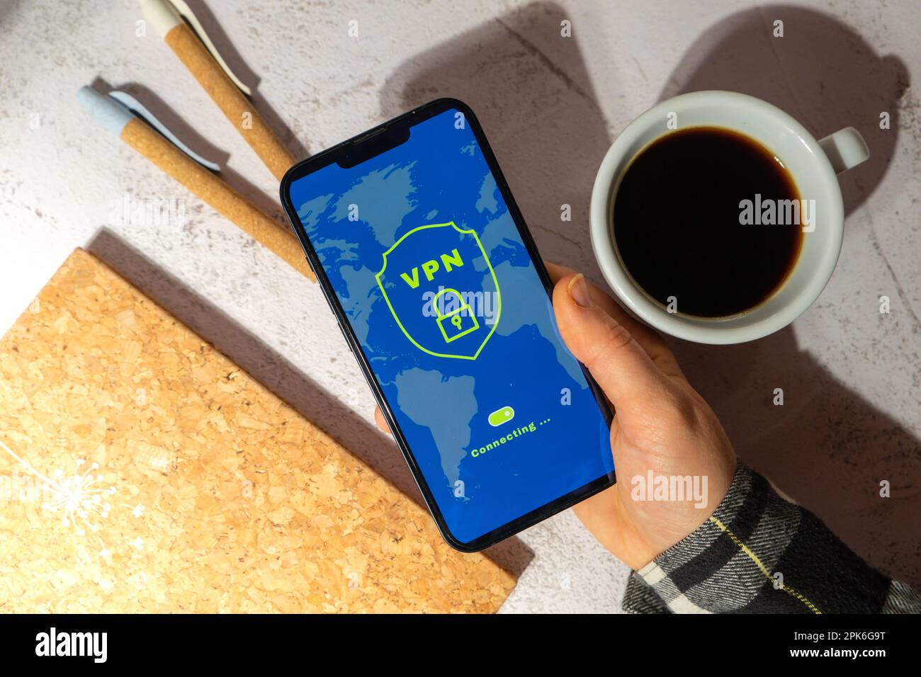 Unrecognizable woman holding Mobile phone App screen of VPN creation Internet protocols for ...