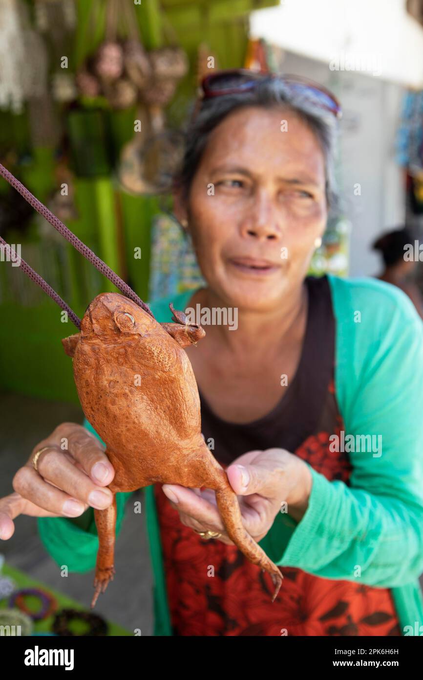 Filipino woman, 53, with a handbag made of frog skin, Puka Beach ...