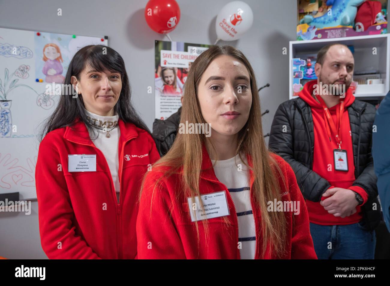 People in red uniforms of the humanitarian organization "Save the ...