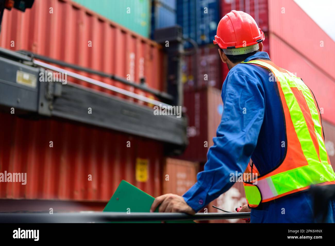 Warehouse engineer worker checking and working at industrial container ...