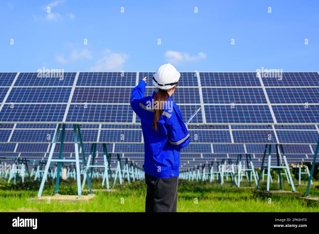 Engineer worker portrait with solar panel at solar farm Stock Photo - Alamy