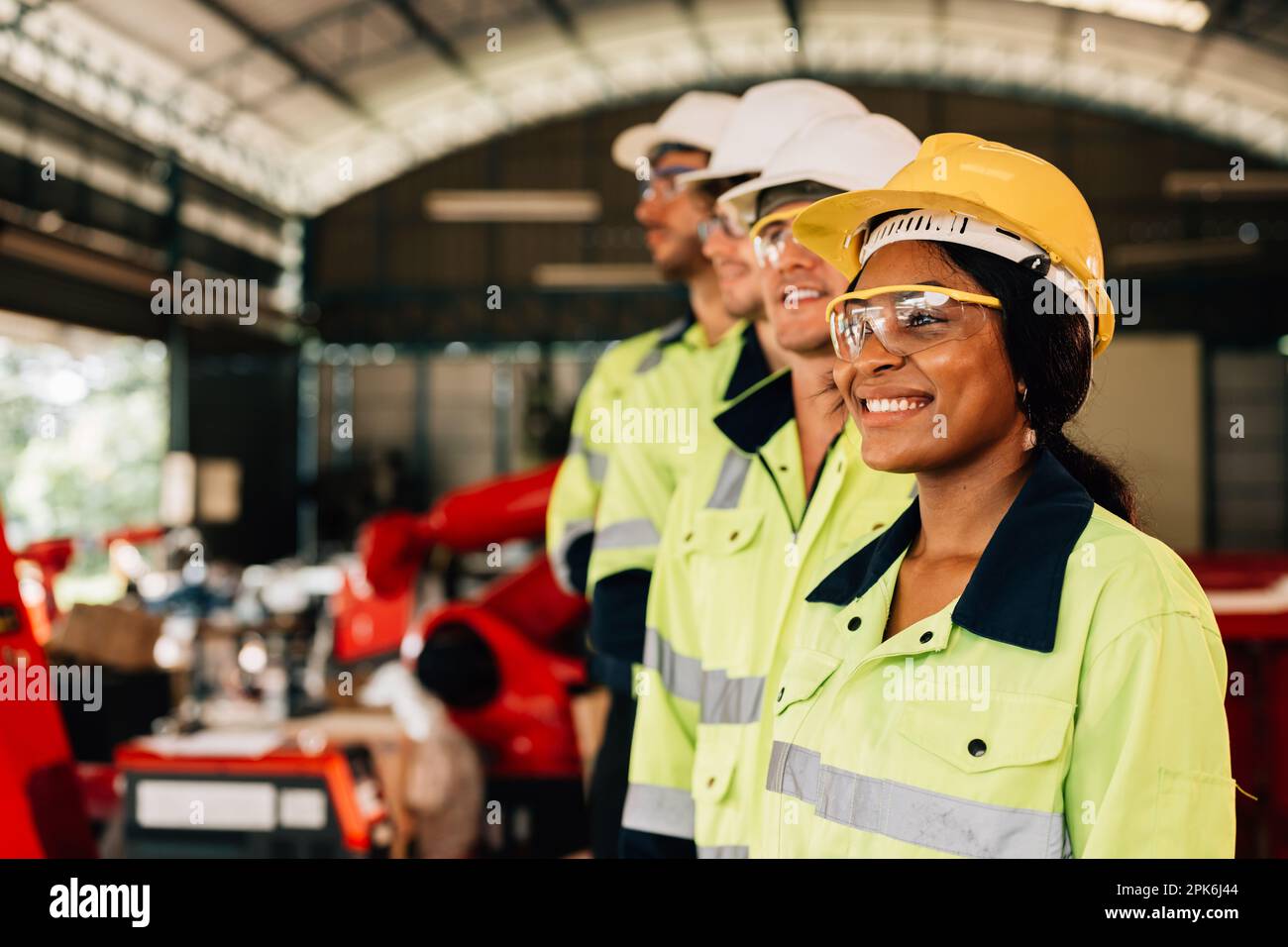 Group of confident engineers workers smiling at factory Stock Photo - Alamy