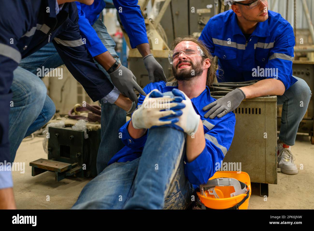 Engineer worker with accident at factory during working Stock Photo - Alamy