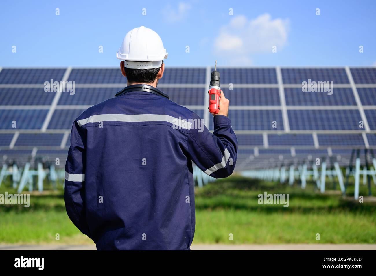 Engineer worker portrait with solar panel at solar farm Stock Photo - Alamy