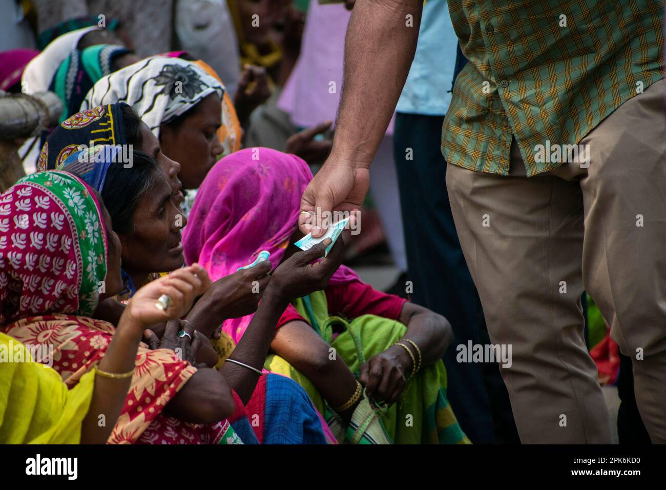 Indian Muslims person give money to needy people after perform the ...