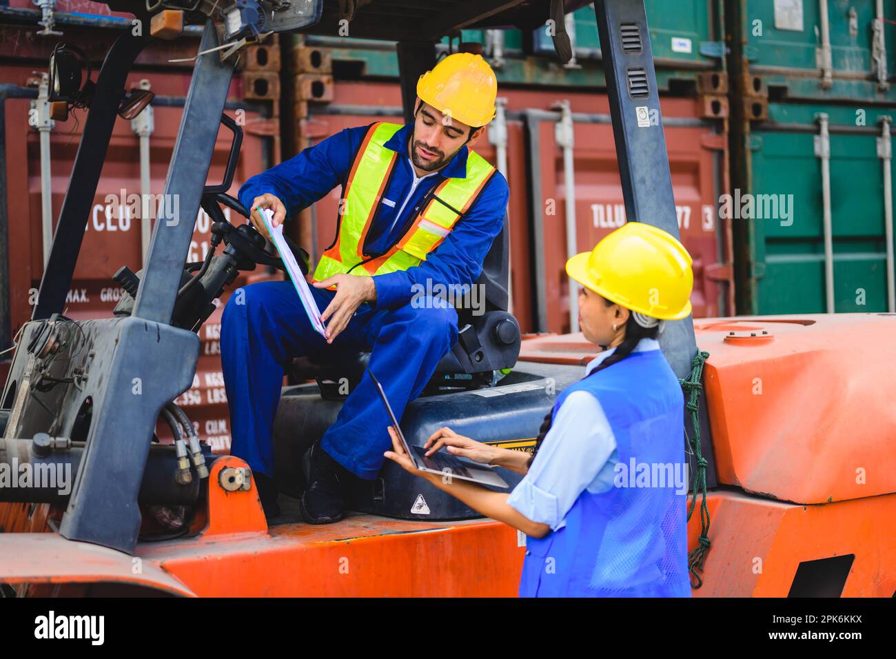 Industrial engineer worker working at overseas shipping container yard ...