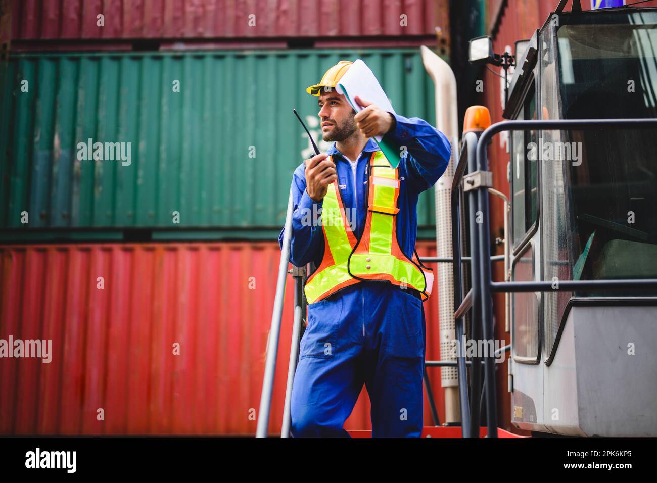 Industrial engineer worker working at overseas shipping container yard ...