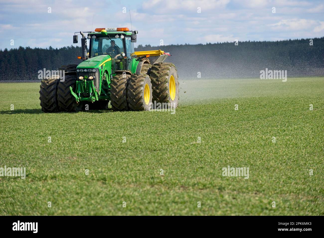 John Deere 8530 tractor with Bredal TX3500 spreader, spreading granular ...
