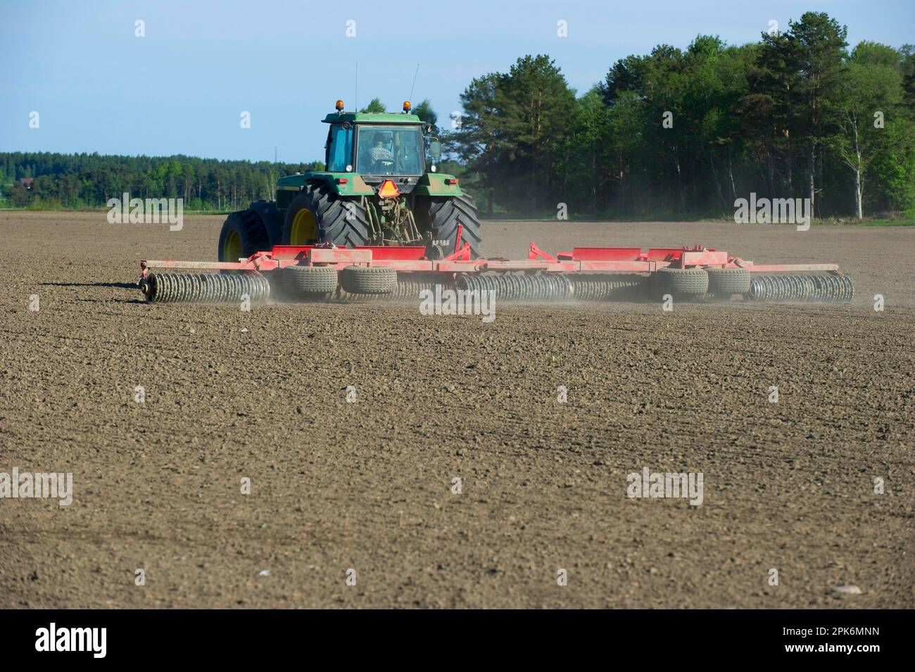 Tractor with wheels, rolling field, Tierp, Sweden Stock Photo - Alamy