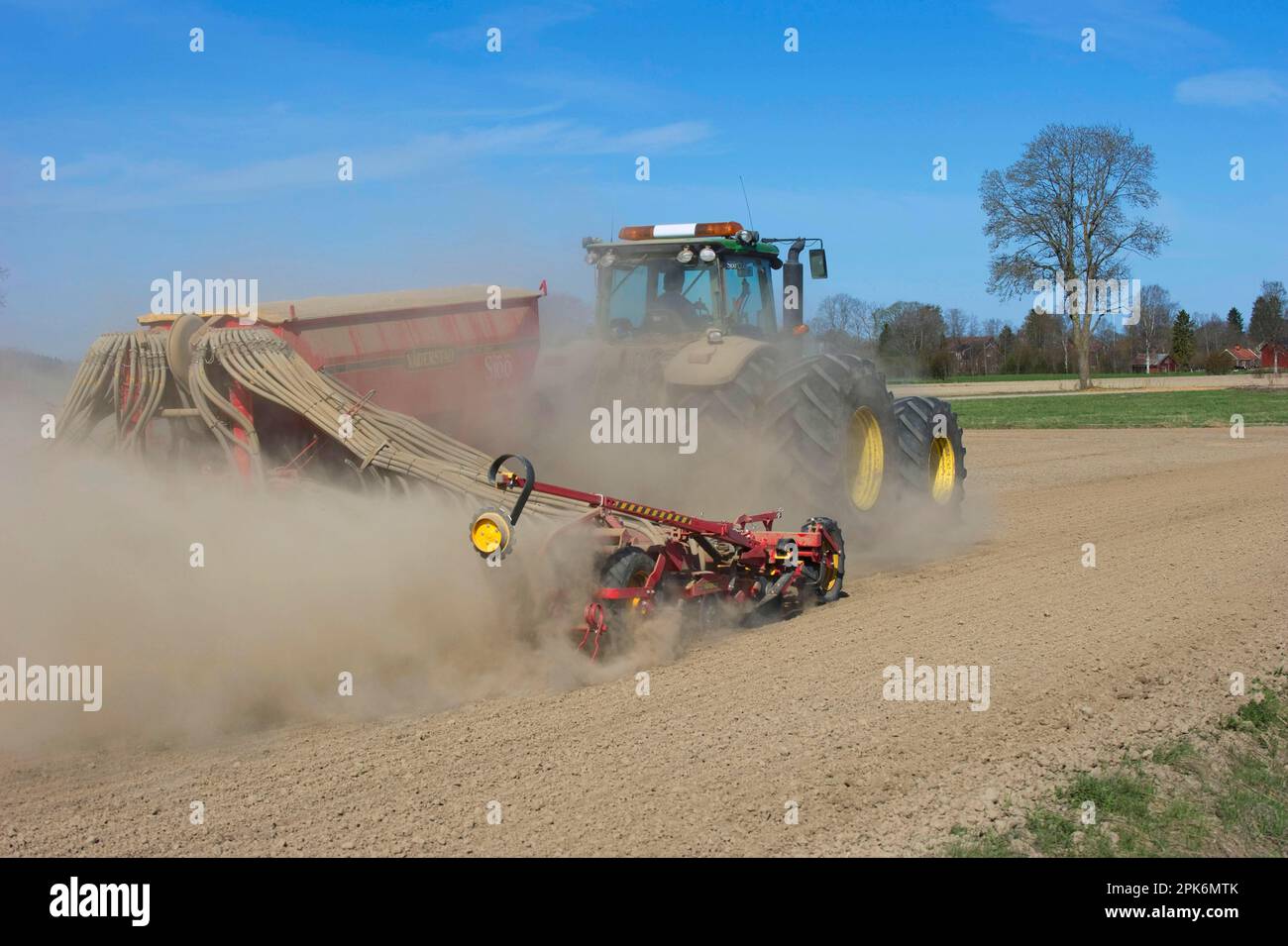 John Deere 8530 tractor with Vaderstad seed drill, with windblown dust ...