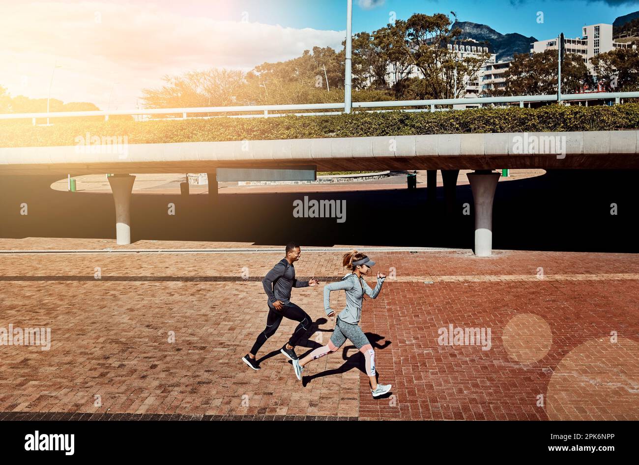 Maintaining their health, together. Full length shot of two young and ...