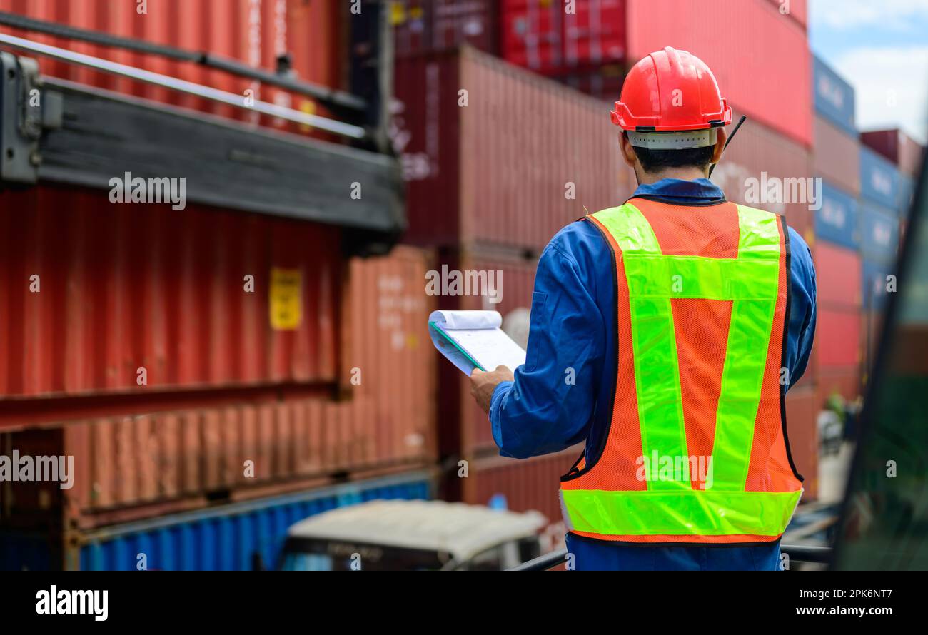 Warehouse engineer worker checking and working at industrial container ...