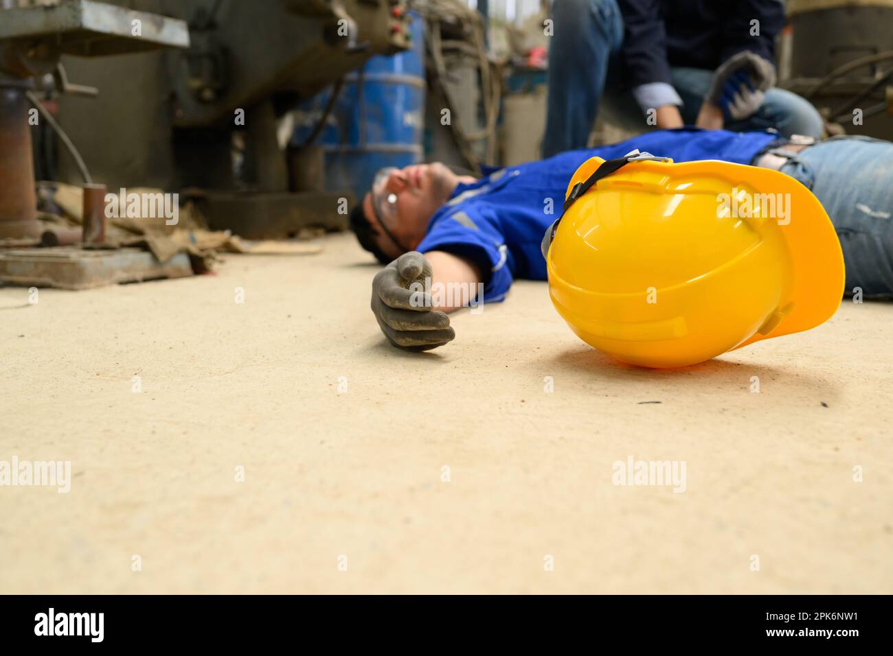 Engineer worker with accident at factory during working Stock Photo - Alamy