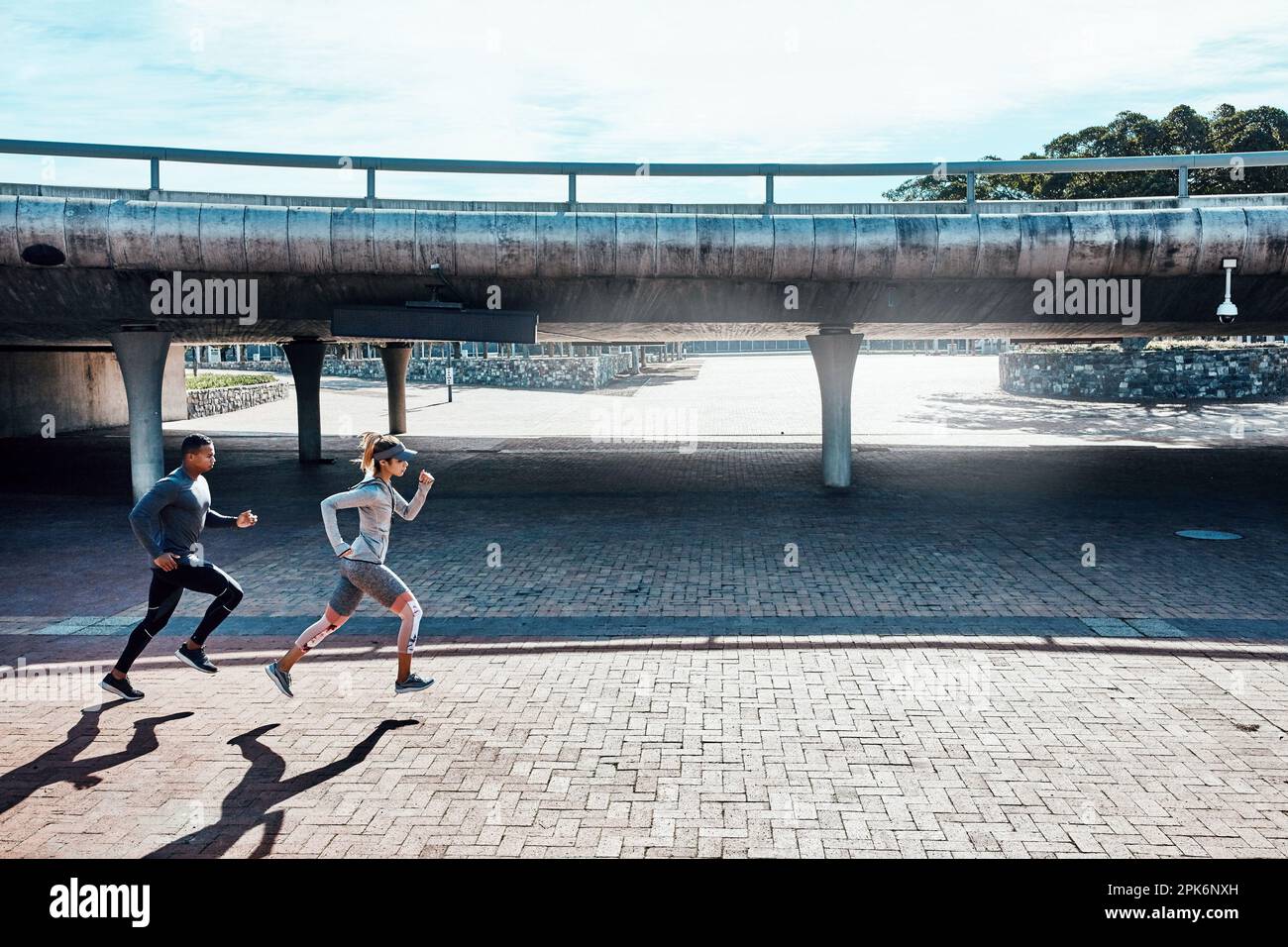 Owning their workout. Full length shot of two young and athletic young ...
