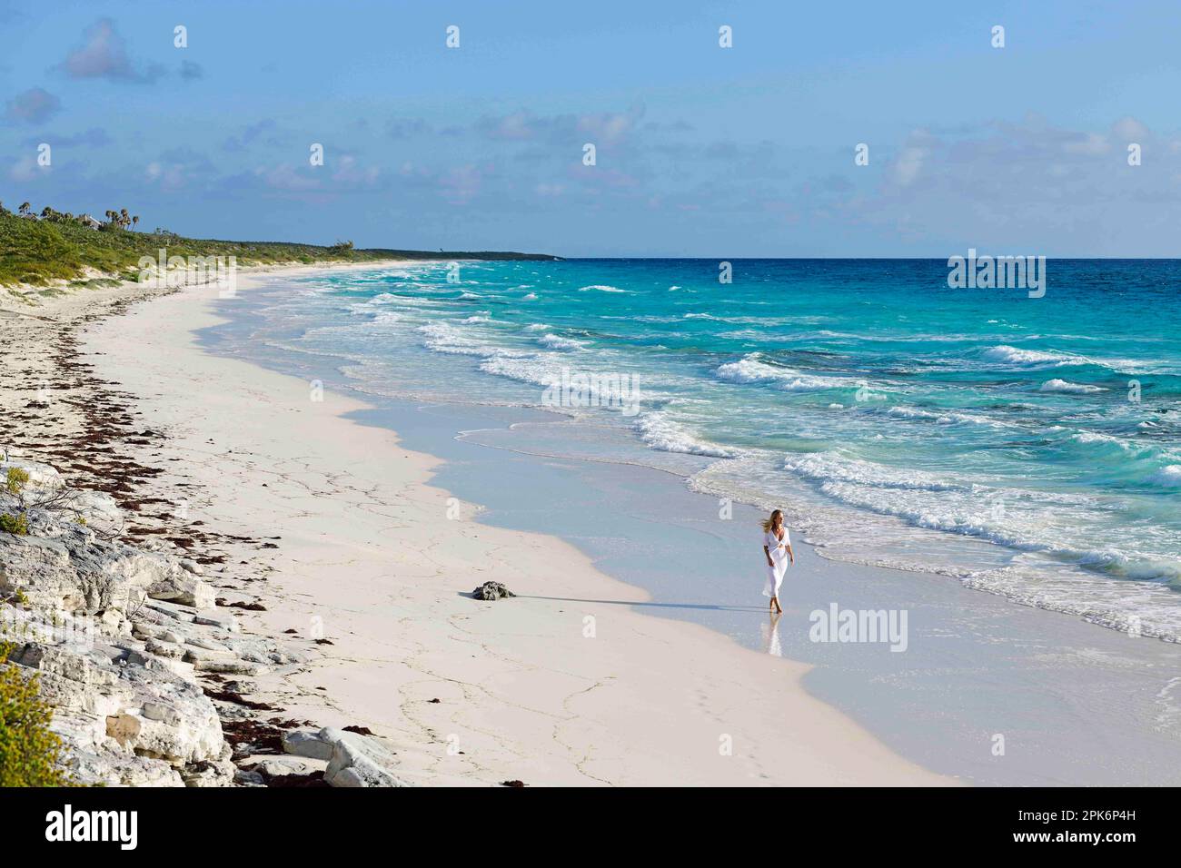 Tourist on the beach of Highbourne Cay, Exuma Cays, Bahamas Stock Photo ...