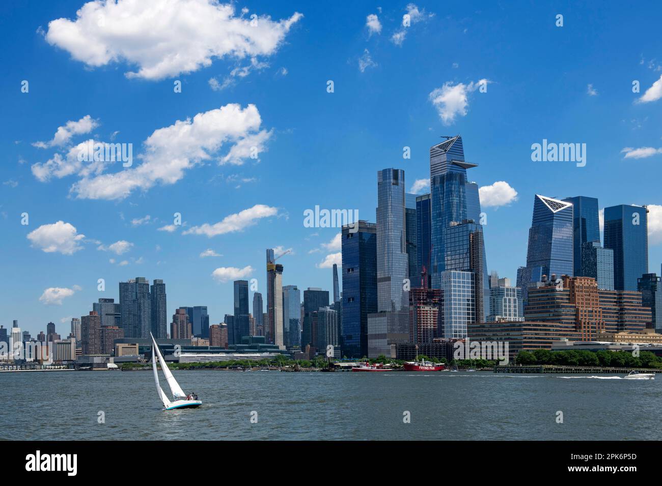 Sailboat on the Hudson River, in the background The Edge building ...