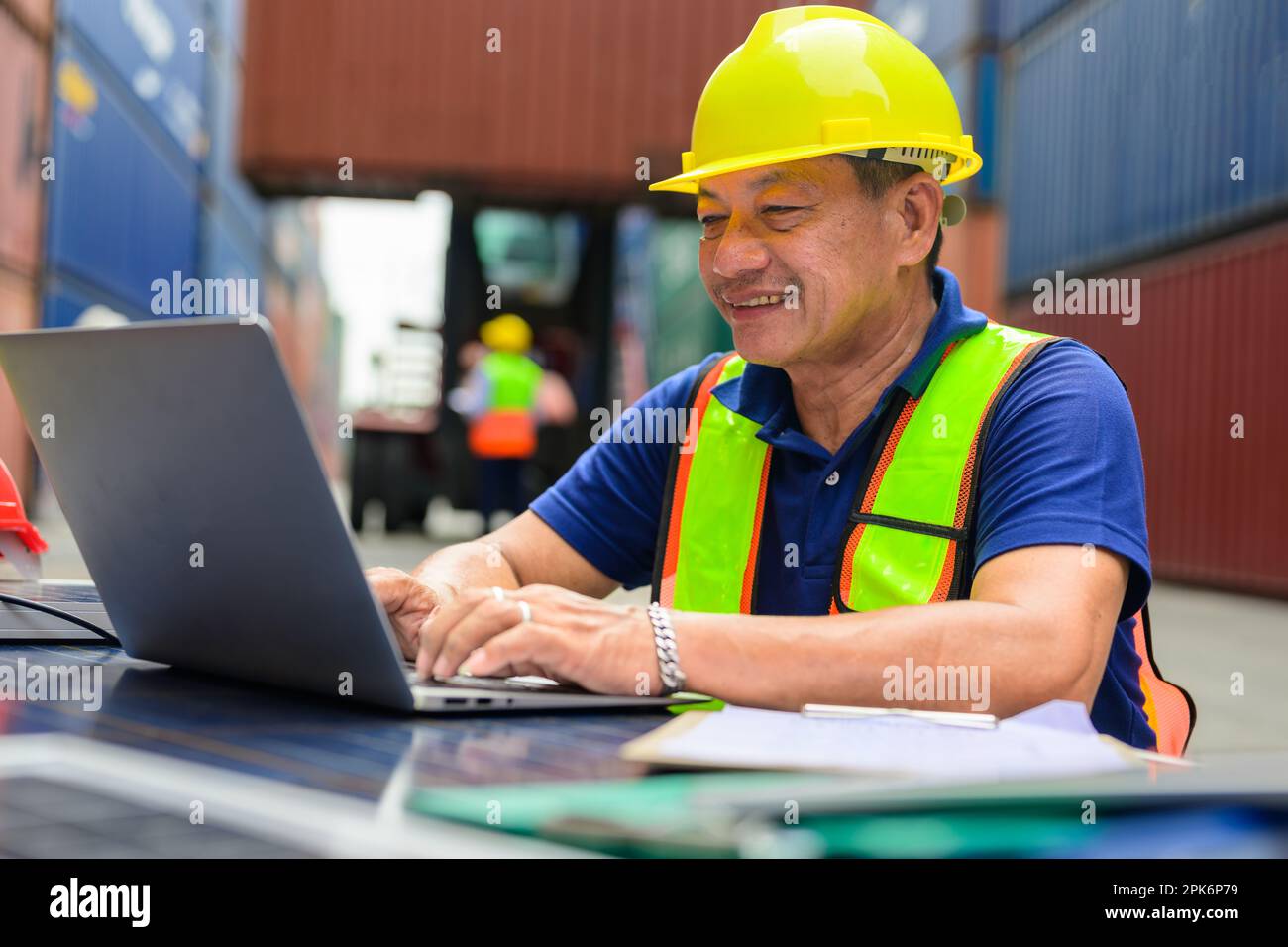 Warehouse engineer worker checking and working at industrial container ...