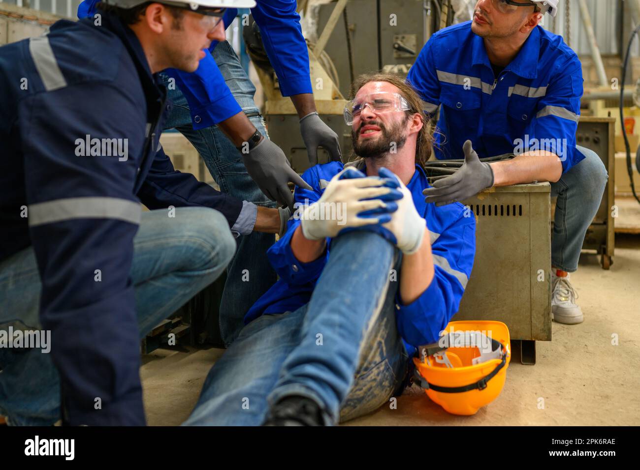 Engineer worker with accident at factory during working Stock Photo - Alamy