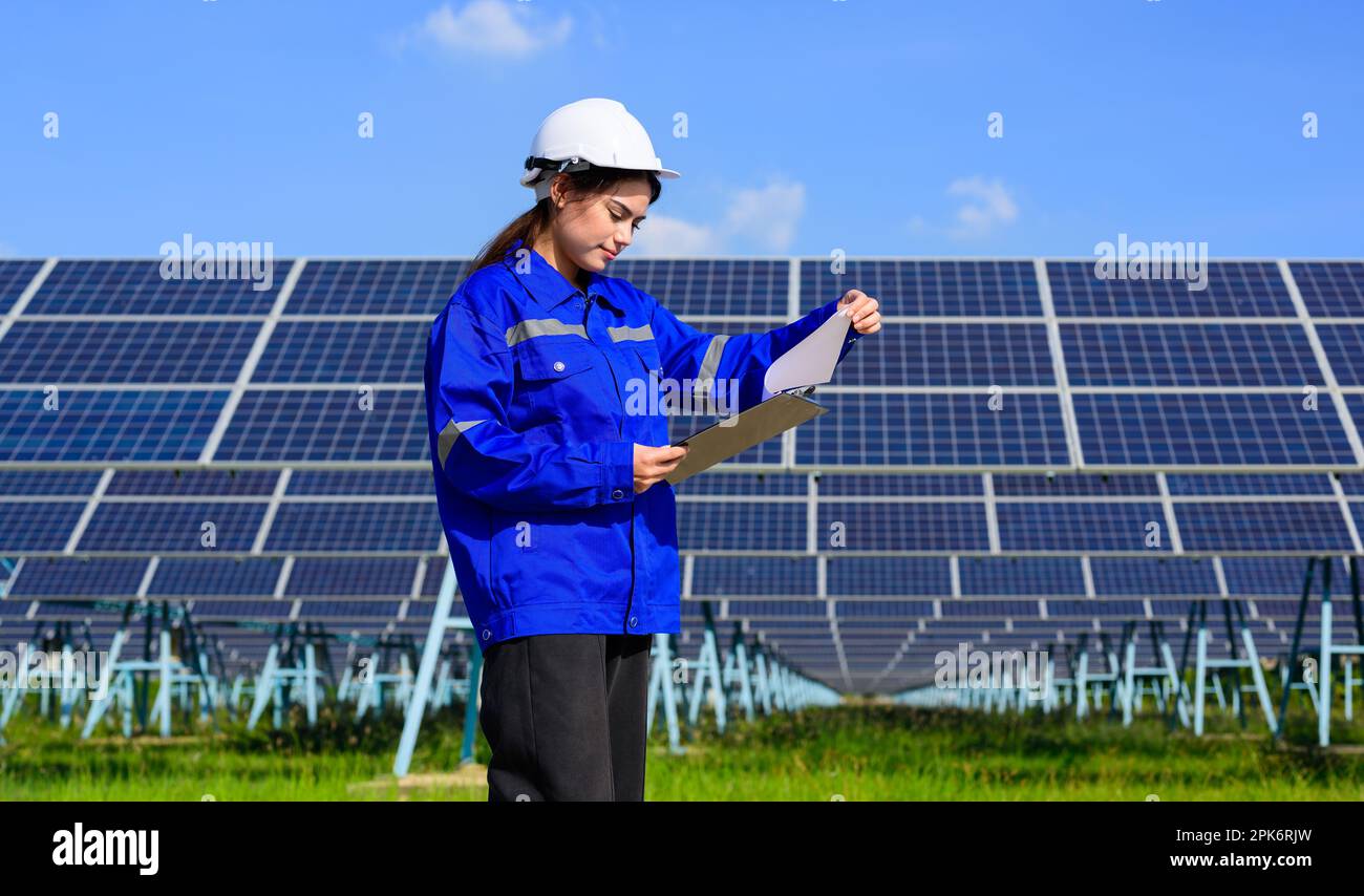 Engineer worker portrait with solar panel at solar farm Stock Photo - Alamy