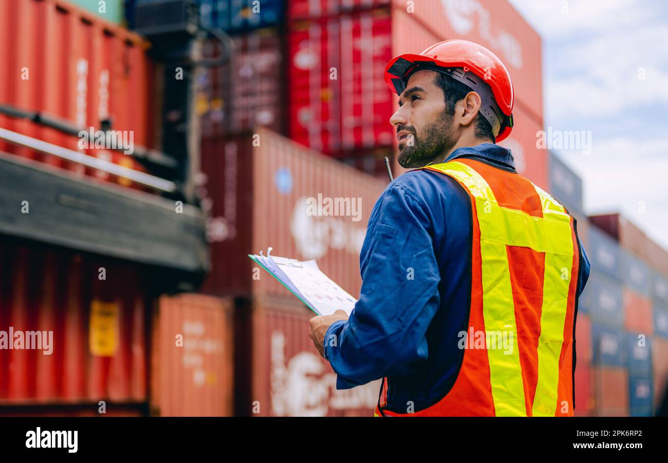 Warehouse engineer worker working at industrial container yard Stock ...